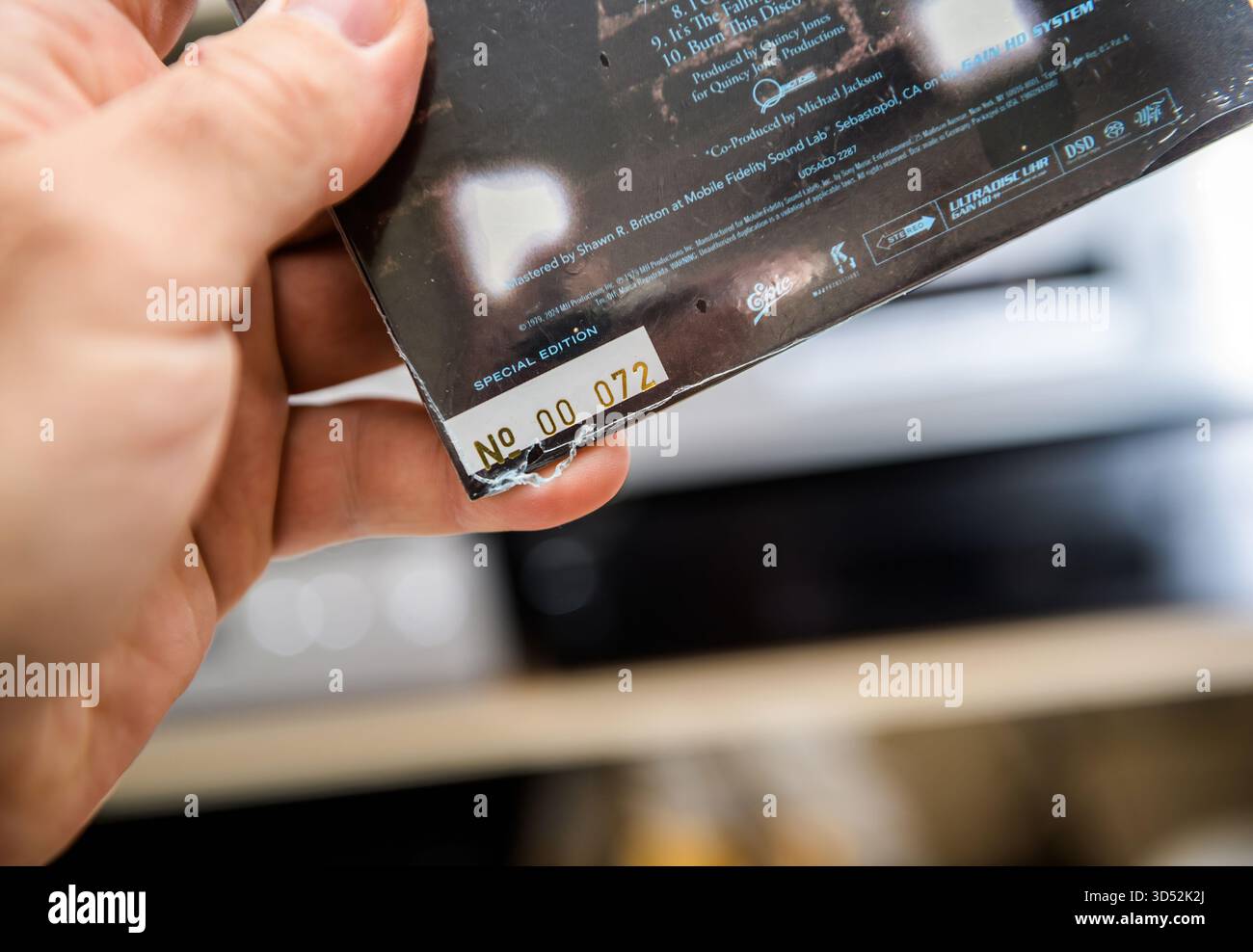 Paris, France - Sep 10, 2025: Close up of a hand holding a numbered limited edition Michael ...