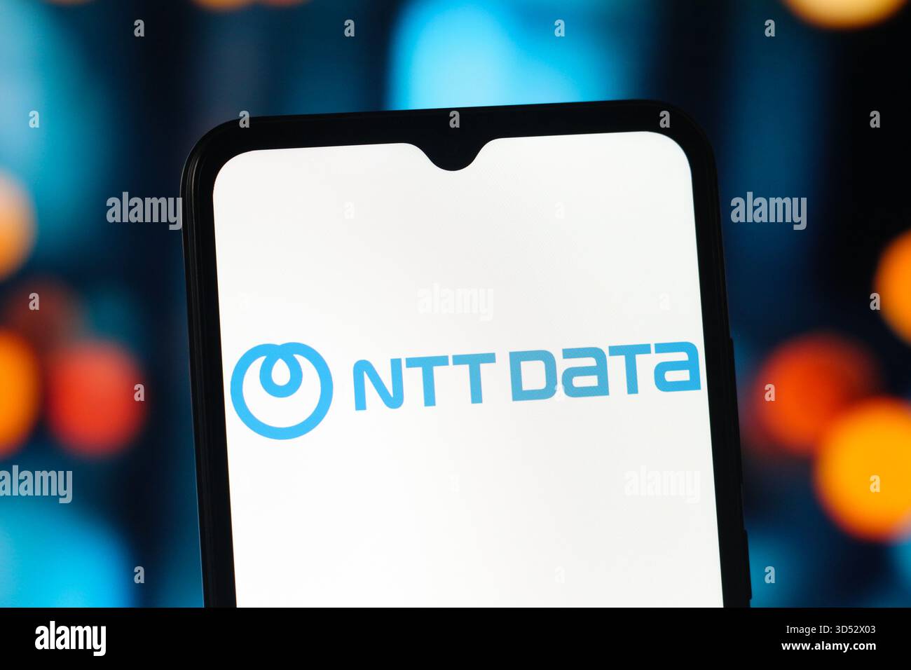 In this photo illustration, the NTT DATA logo is seen displayed on a ...