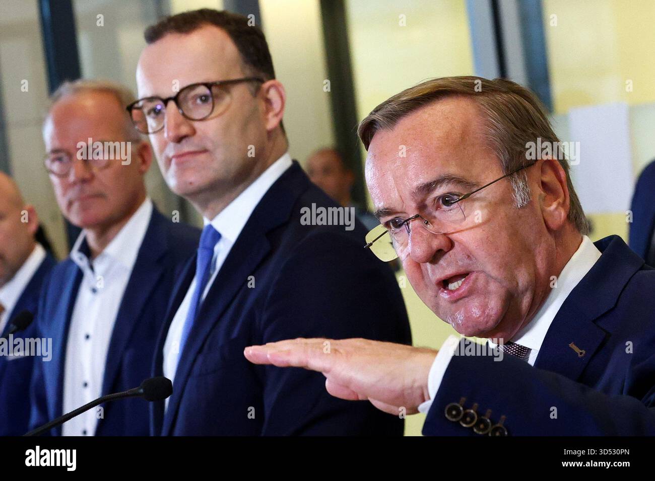 German Defence Minister Boris Pistorius, right, addresses the media at ...