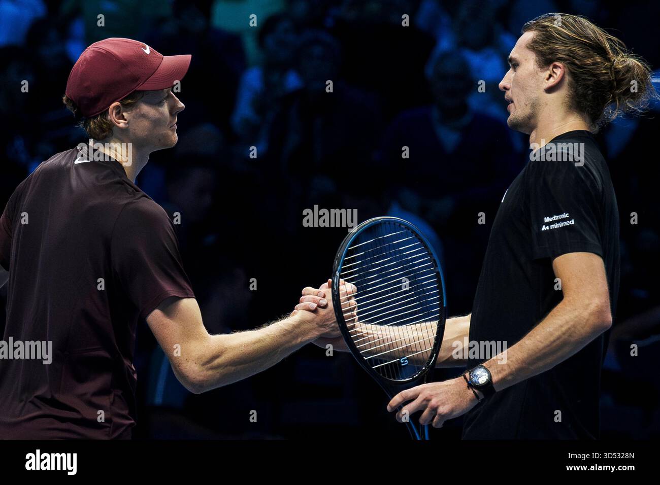 Jannik Sinner (L) of Italy shakes hands with Alexander Zverev of ...