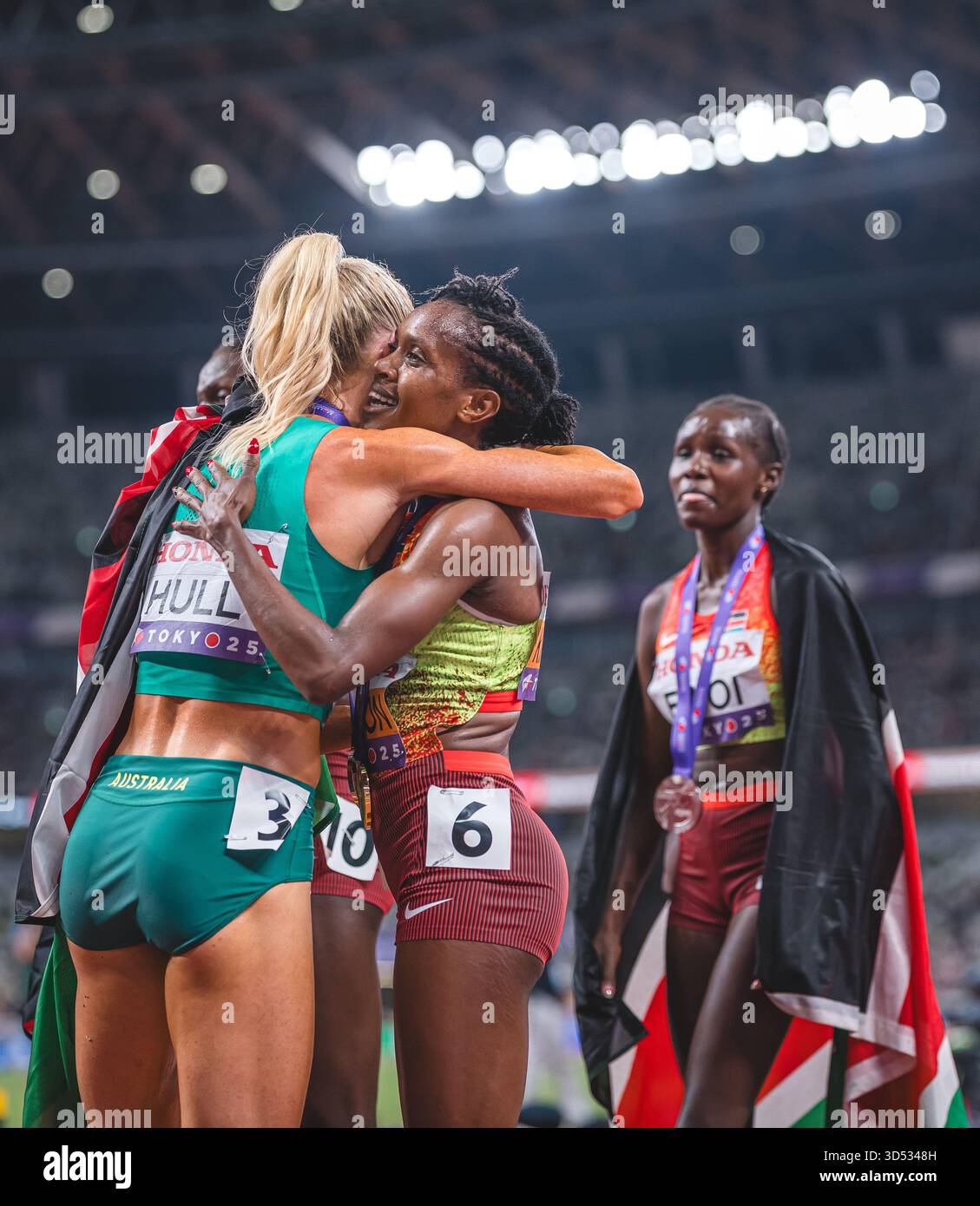 Jessica Hull and Faith Kipyegon celebrating her medal with her country ...