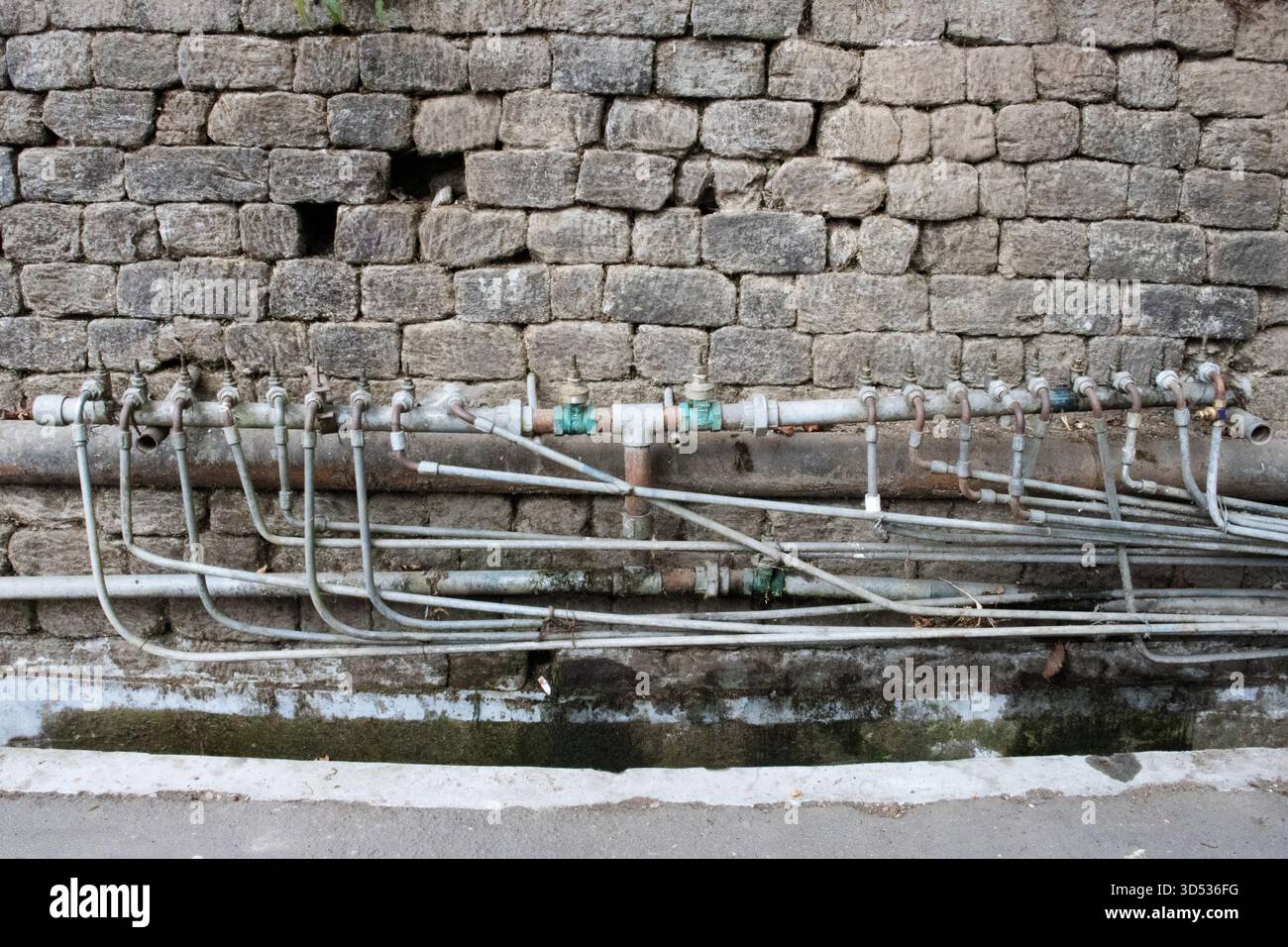 Typical large scale metal water suply pipe for the town and homes in ...