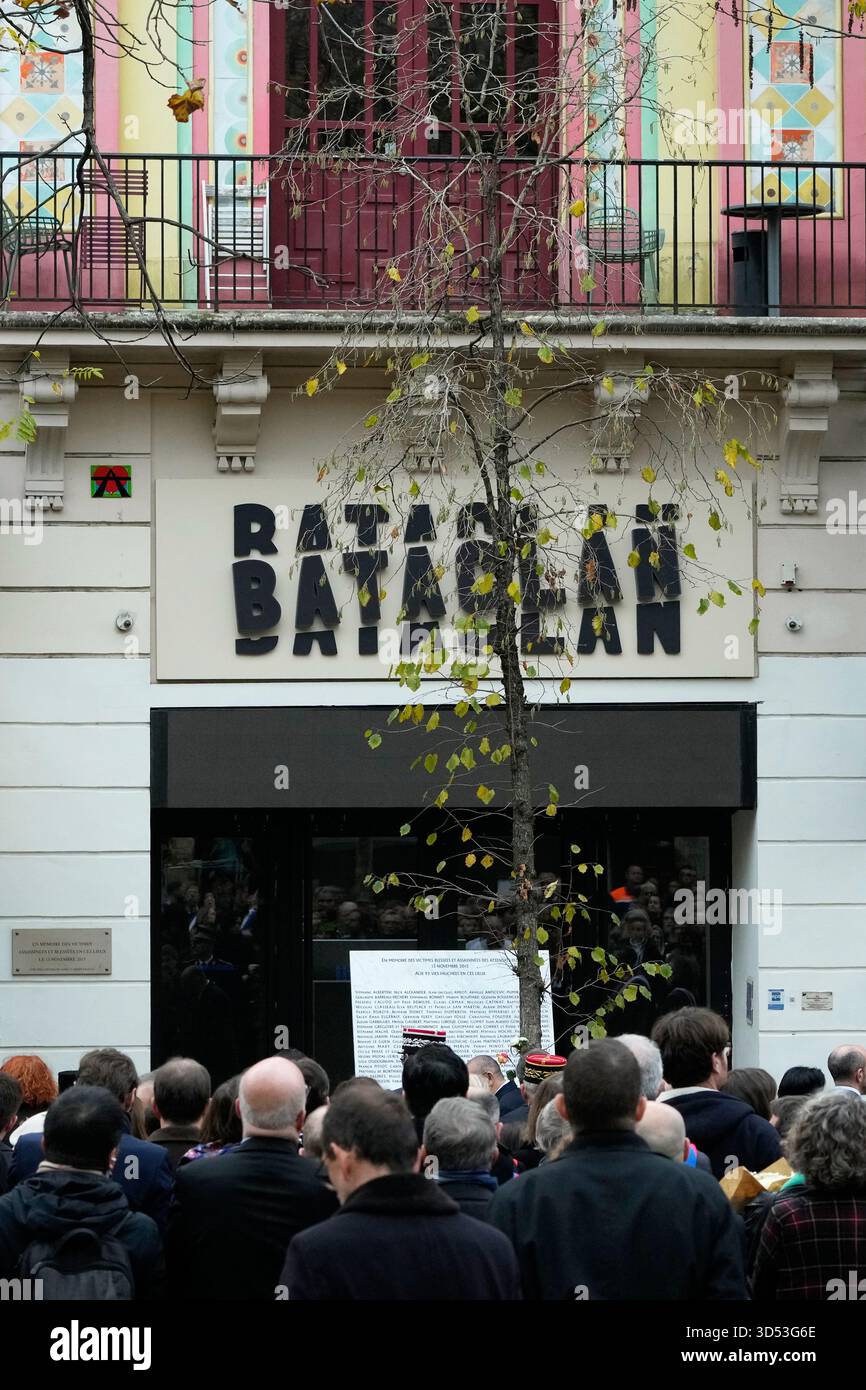 People and officials gather outside the Bataclan concert hall as Paris ...