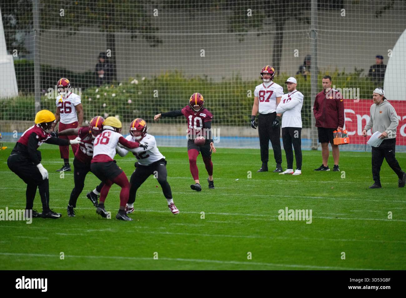 Washington Commanders punter Tress Way (10) punts the ball during a ...