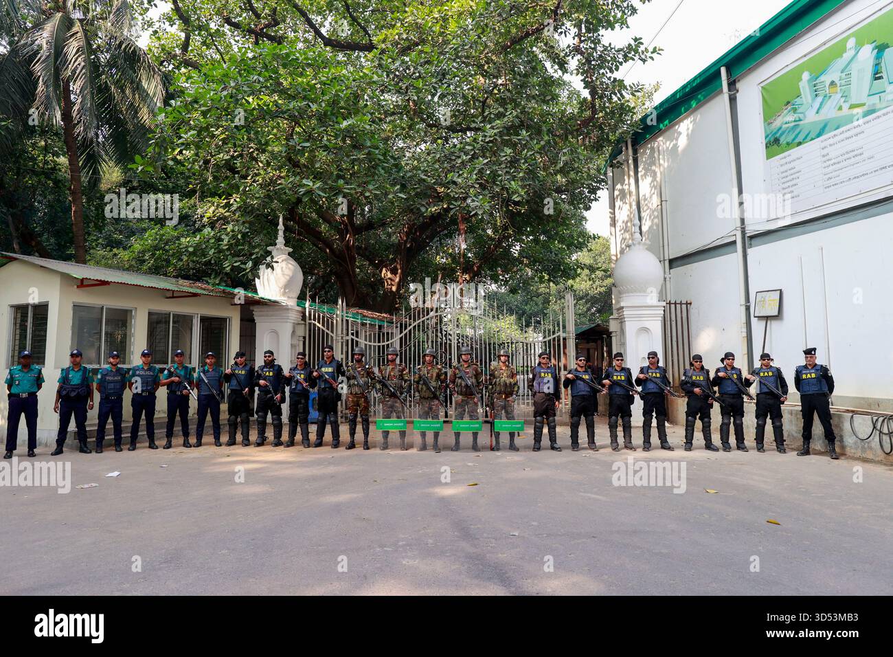 Bangladeshi security personnel stand guard in front of the ...