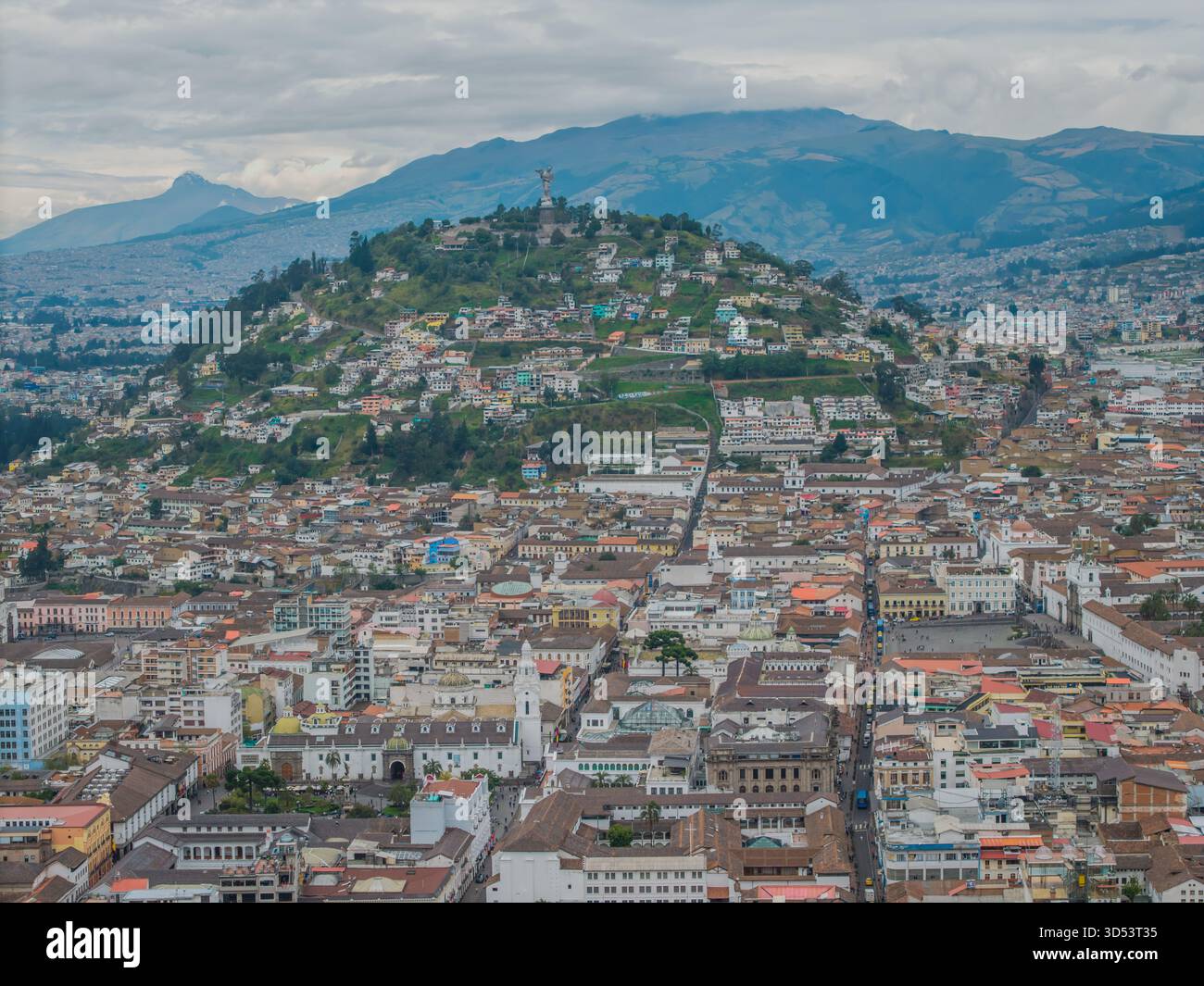 Aerial view of the city stretching towards the iconic Panecillo hill ...