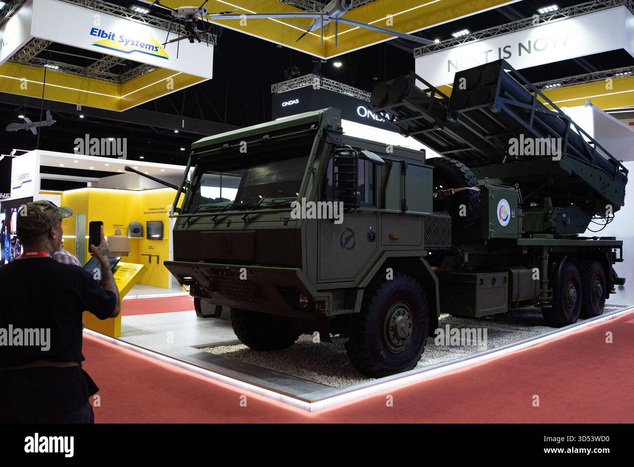 A visitor takes a photo of a transporter erector launcher during the ...