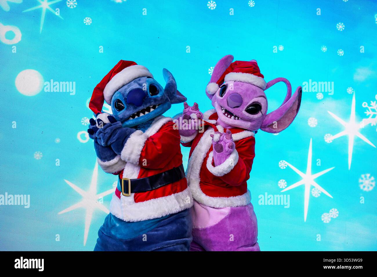 The Disney characters from stitch wearing Christmas themed costumes at ...