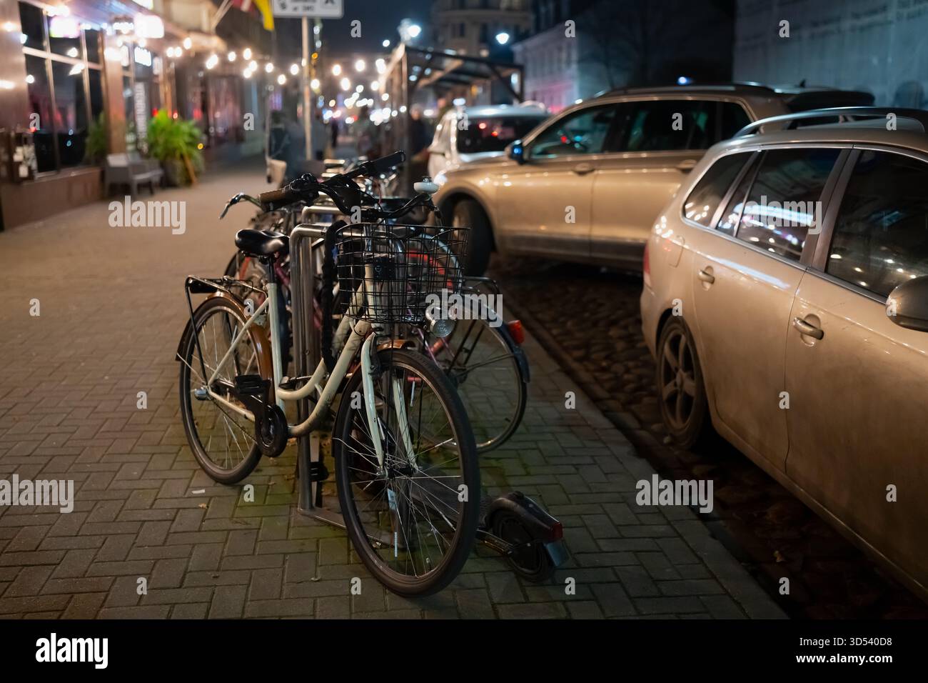 Secure bicycle parking setup with metal locking station on paved ...