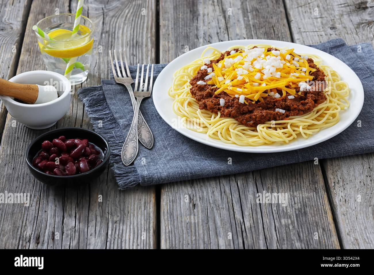 Authentic Cincinnati chili, spiced meat sauce, chopped onion, grated ...
