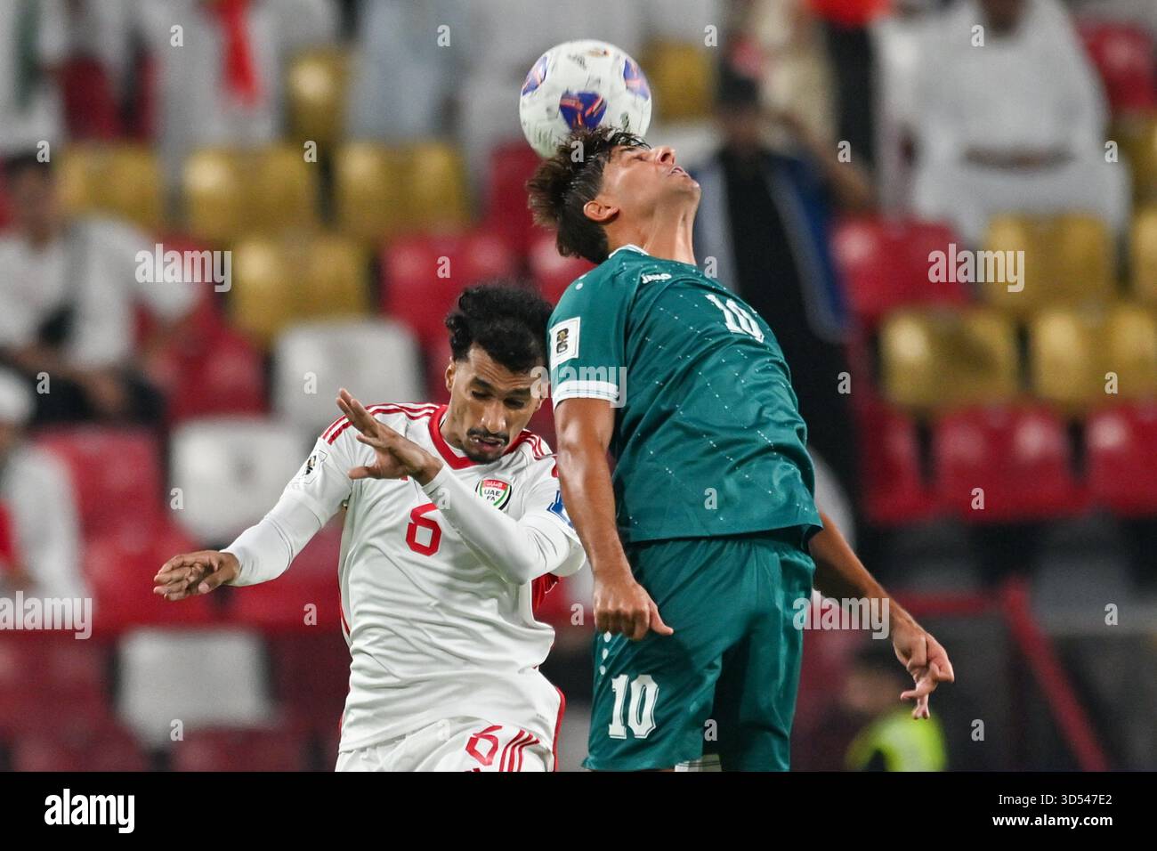 Iraqi's Mohanad Ali, right, heads the ball past Abdalla Ramadan of the ...