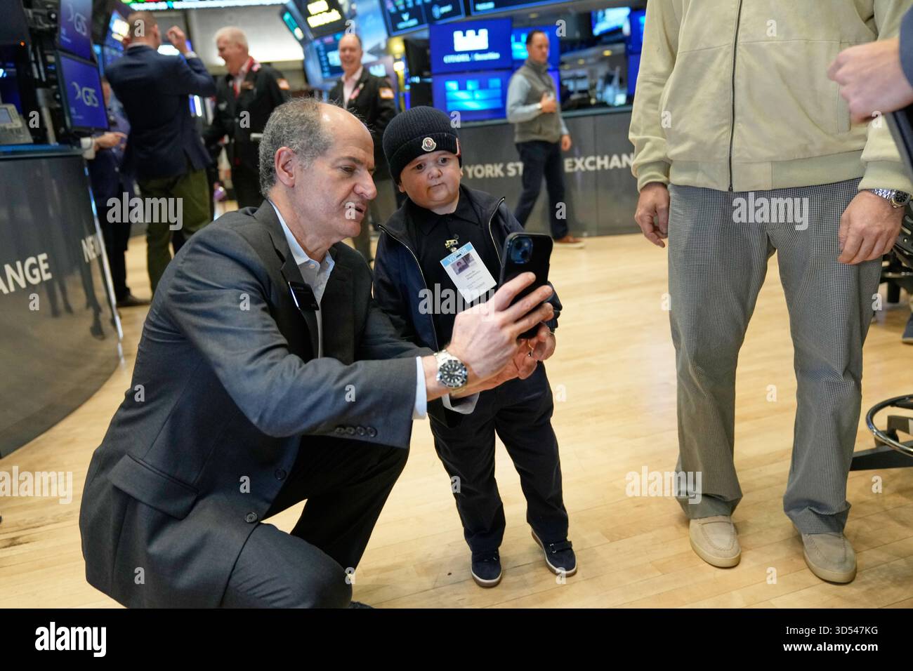 Social media personality Hasbulla Magomedov, center, poses for pictures ...
