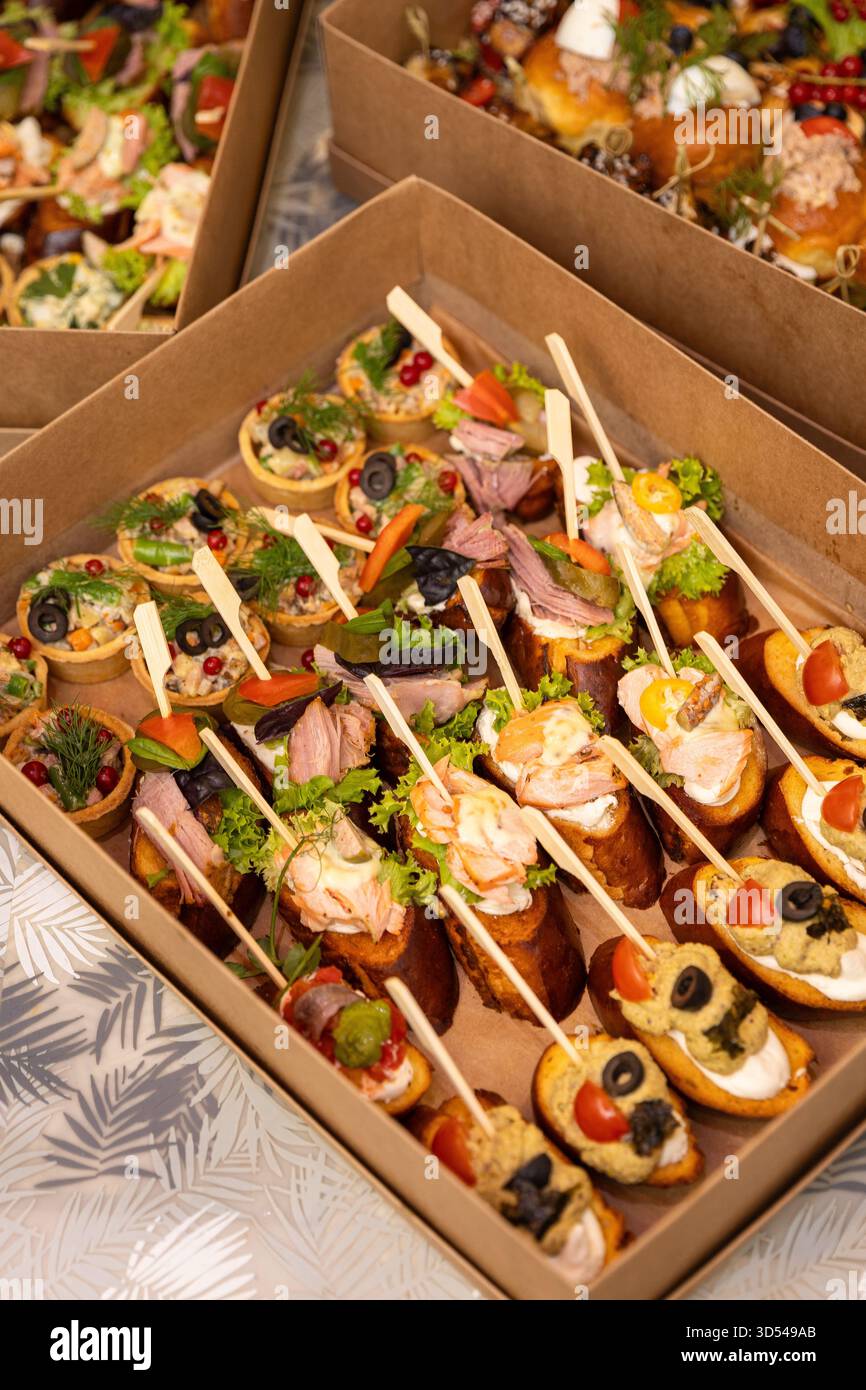 Catering box with assorted canapes and bruschetta for party buffet and ...