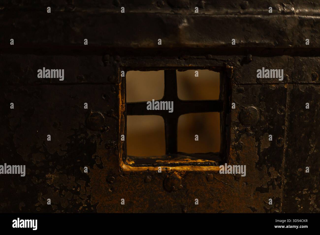 Stone prison cell inside an old medieval castle, rusty metal bars and ...