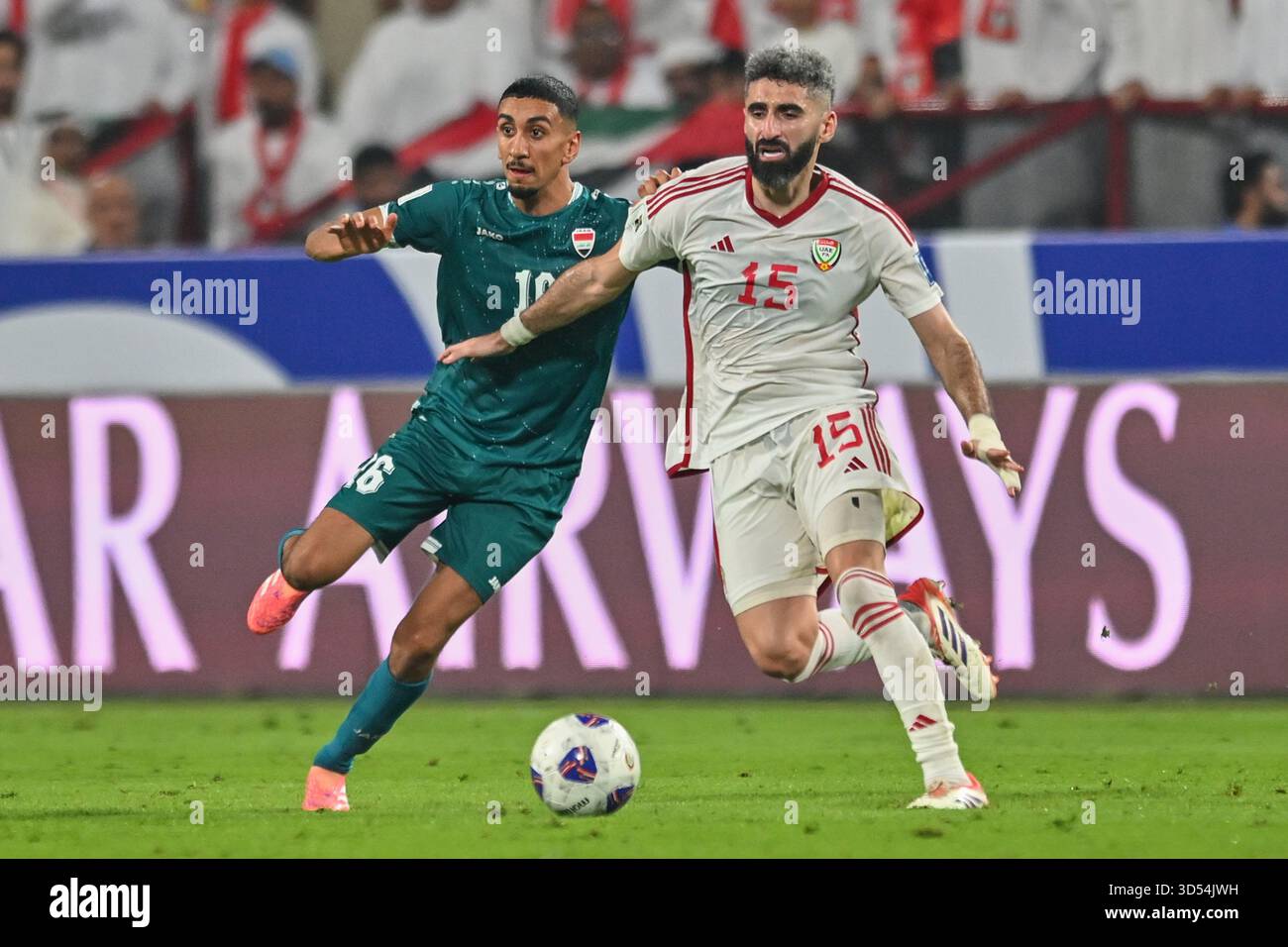 Yahia Nader of the UAE, right, is challenged by Iraqi's Amir Fouad ...