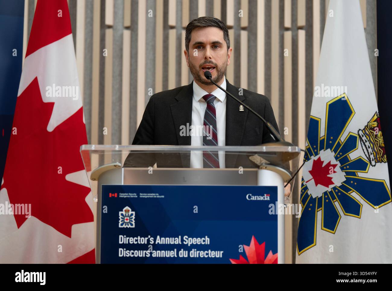 CSIS Director Daniel Rogers speaks with reporters following a speech in ...
