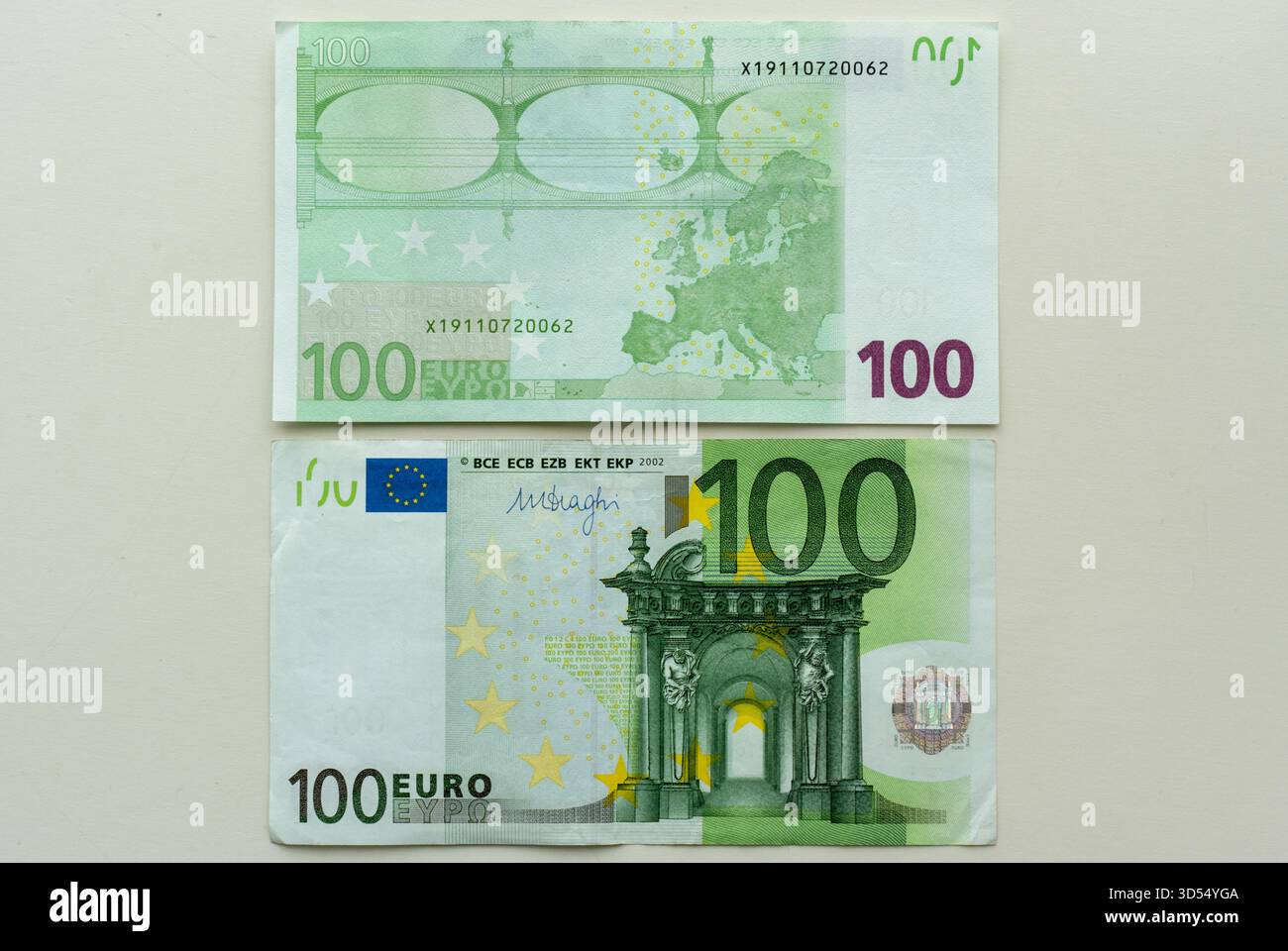 Front and back sides of hundred euro banknote showing architectural ...