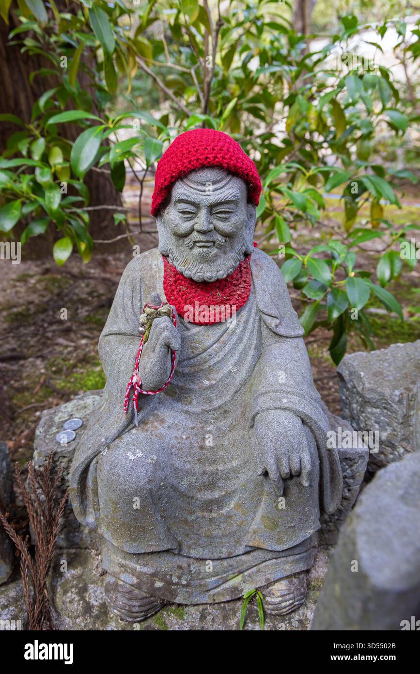 Buddha with red caps at Buddha temple Takifudo island Miyajima ...