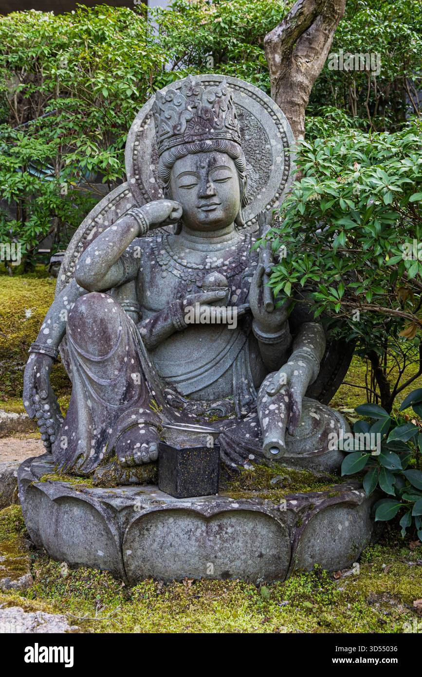 Large Buddha with jar at temple Takifudo island Miyajima Hatsukaichi ...