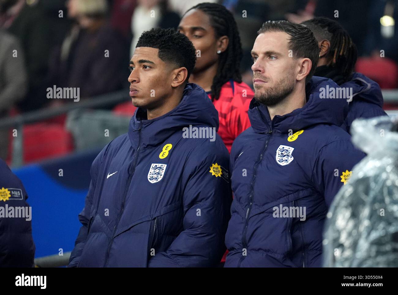England's Jude Bellingham (left) and Jordan Henderson on the substitute ...