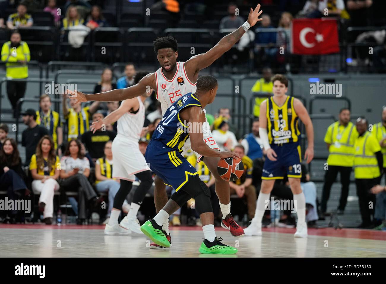 Hapoel's Dan Oturu, background, and Fenerbahce's Devon Hall challenge ...
