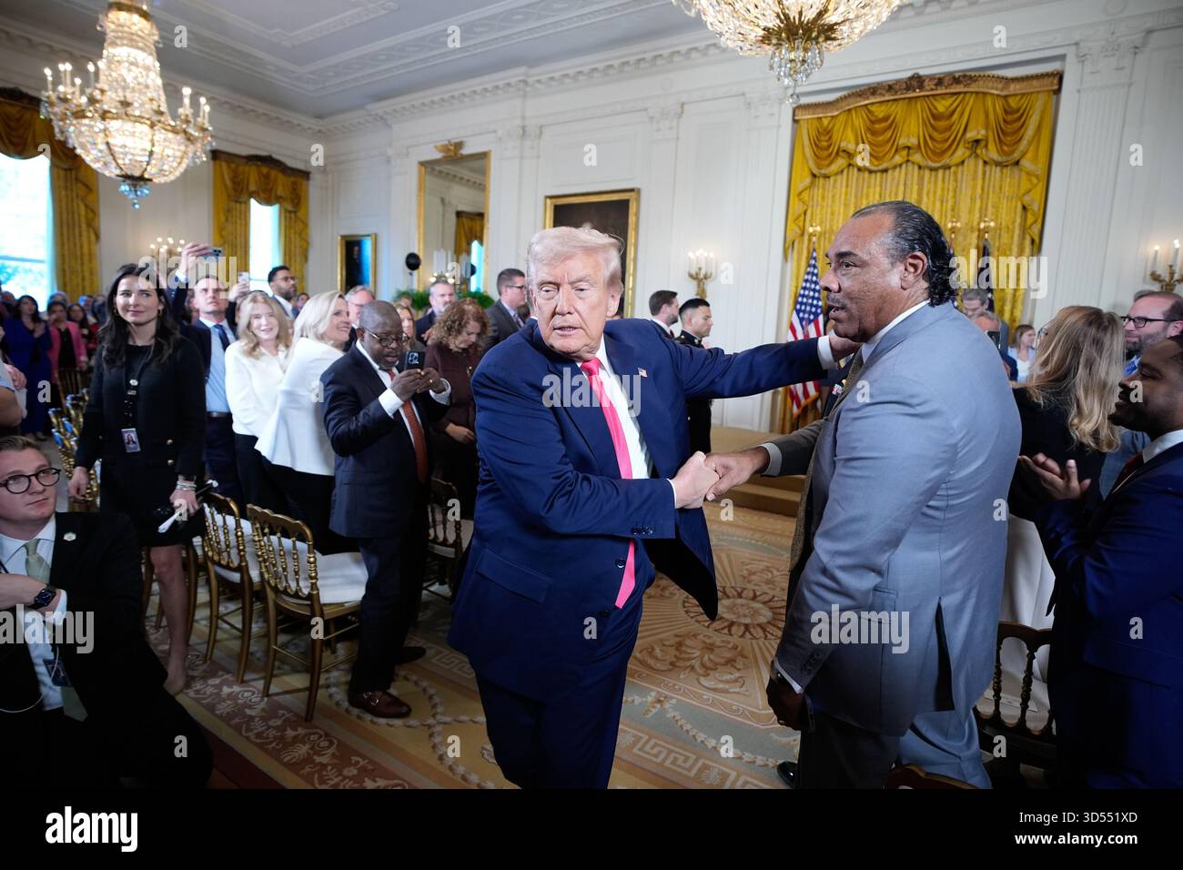 US President Donald Trump leaves the signing ceremony for the ...