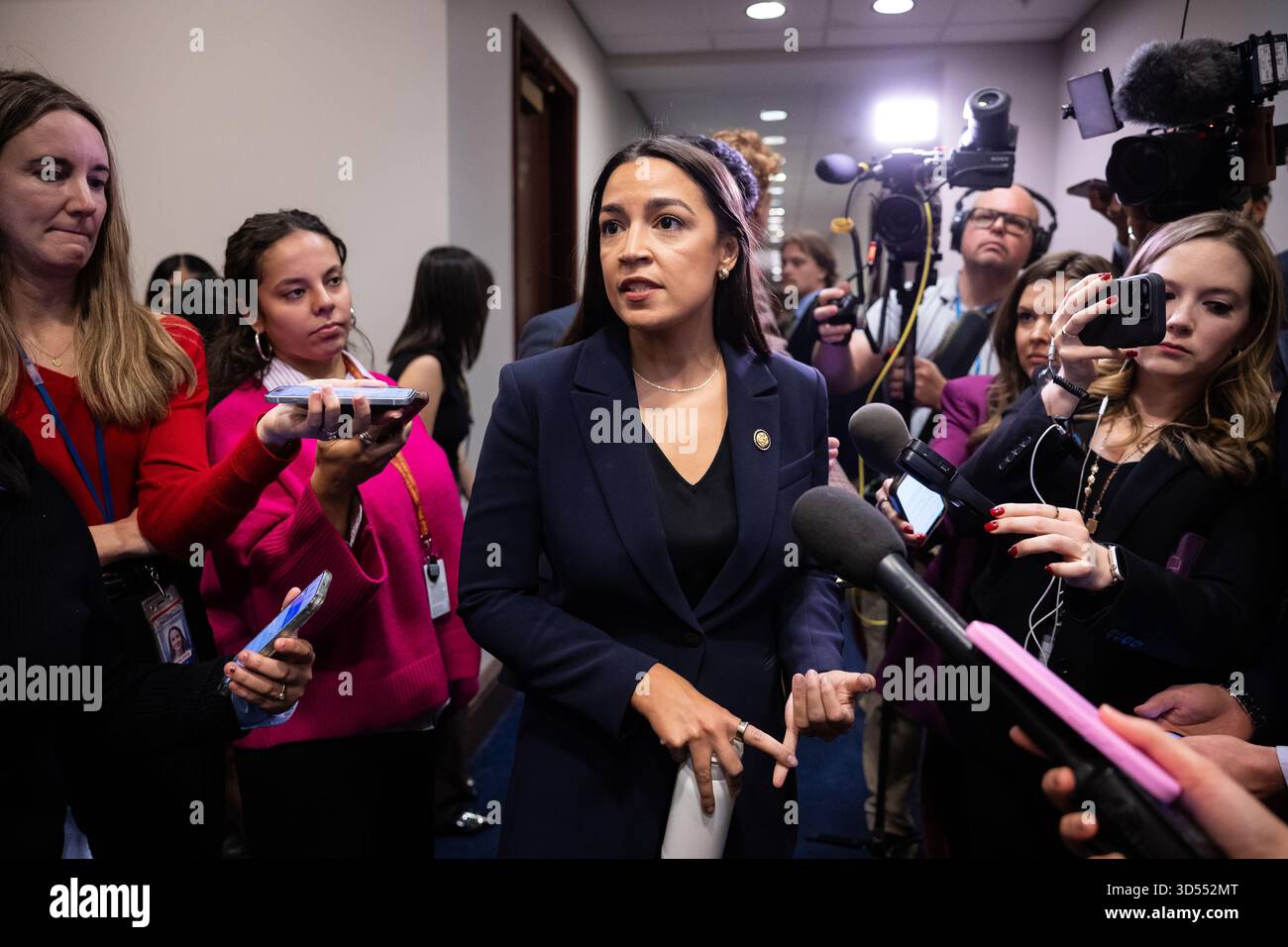 Rep. Alexandria Ocasio-Cortez (D-N.Y.) speaks with reporters as she ...