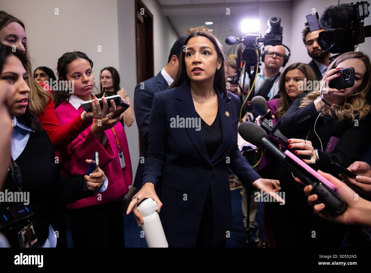 Rep. Alexandria Ocasio-Cortez (D-N.Y.) speaks with reporters as she ...