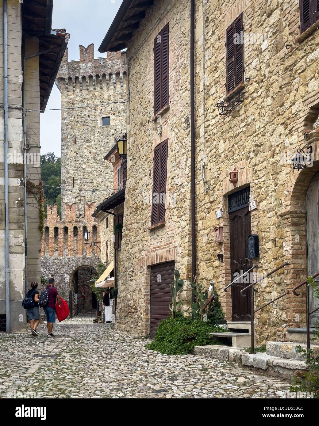 Scenic cobblestone street in Vigoleno, a typical medieval village in ...