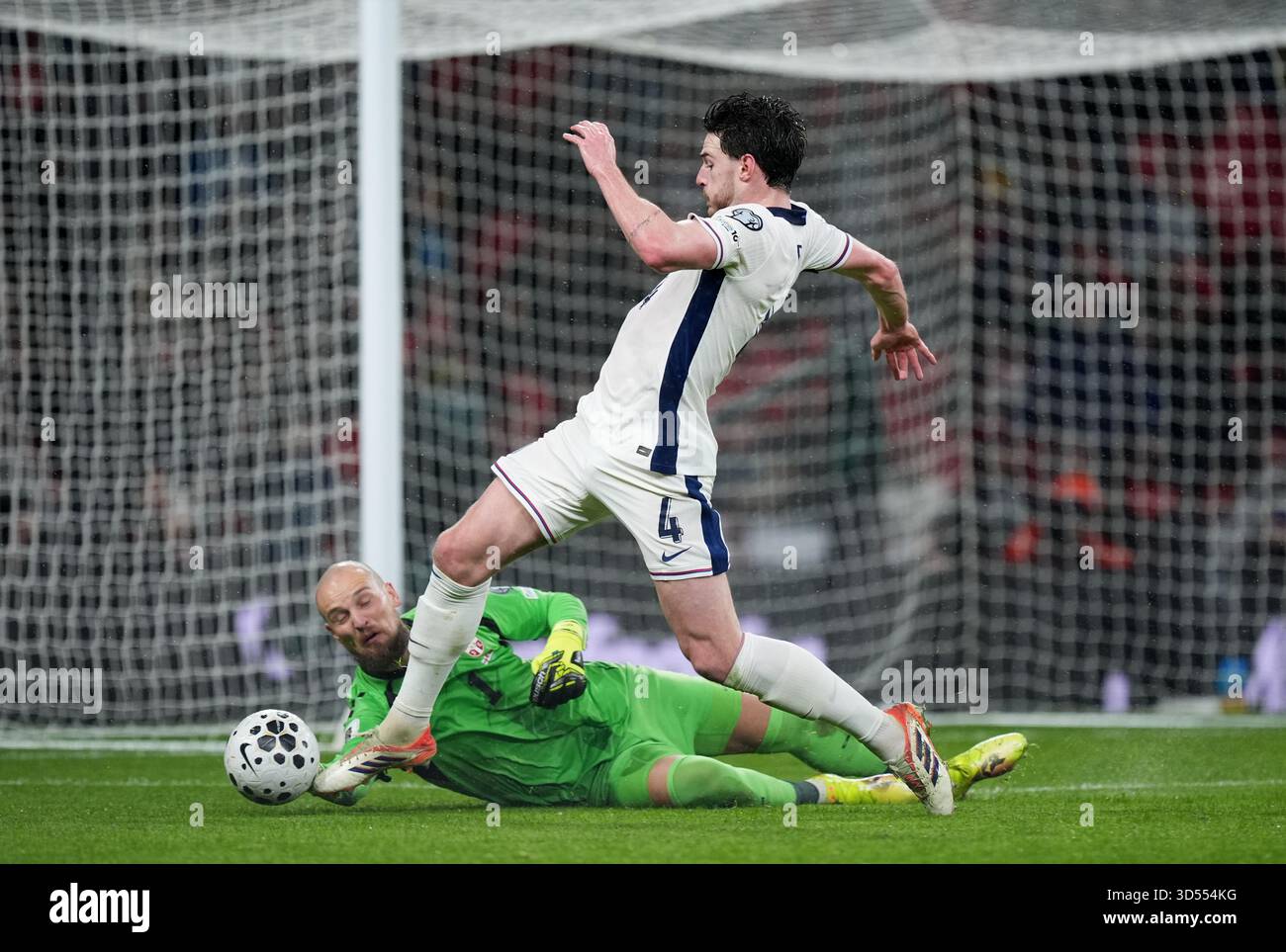 Serbia goalkeeper Predrag Rajkovic makes a save from England's Declan ...
