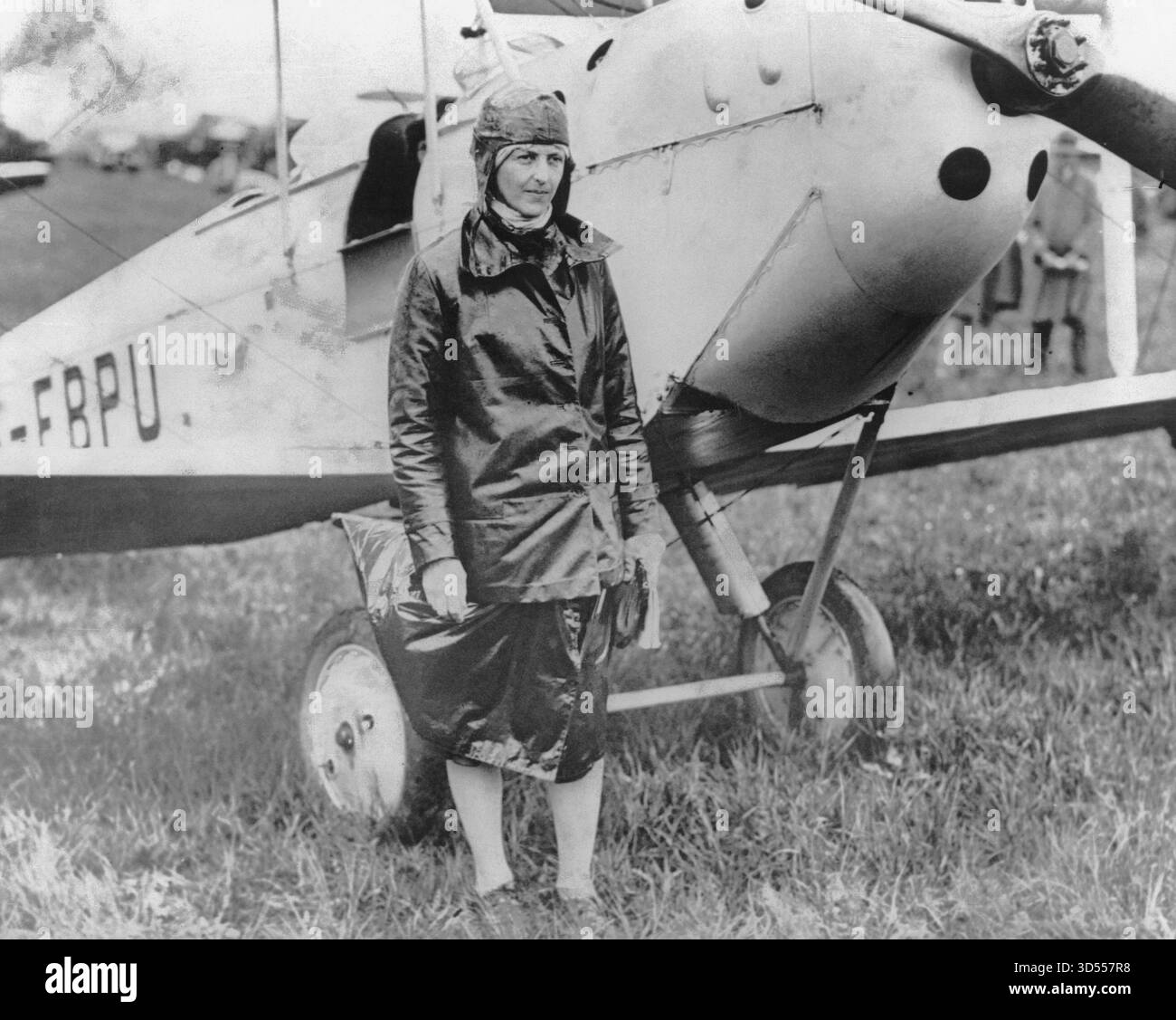 Early model female pilot standing next to her airplane Stock Photo - Alamy