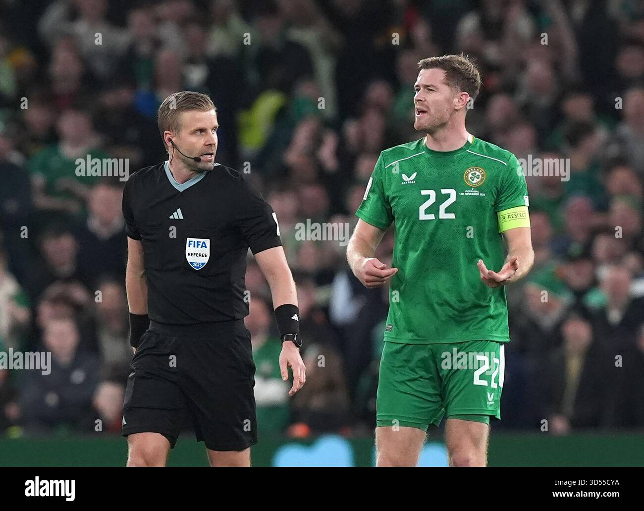 Republic of Ireland's Nathan Collins (right) appeals to referee Glenn ...