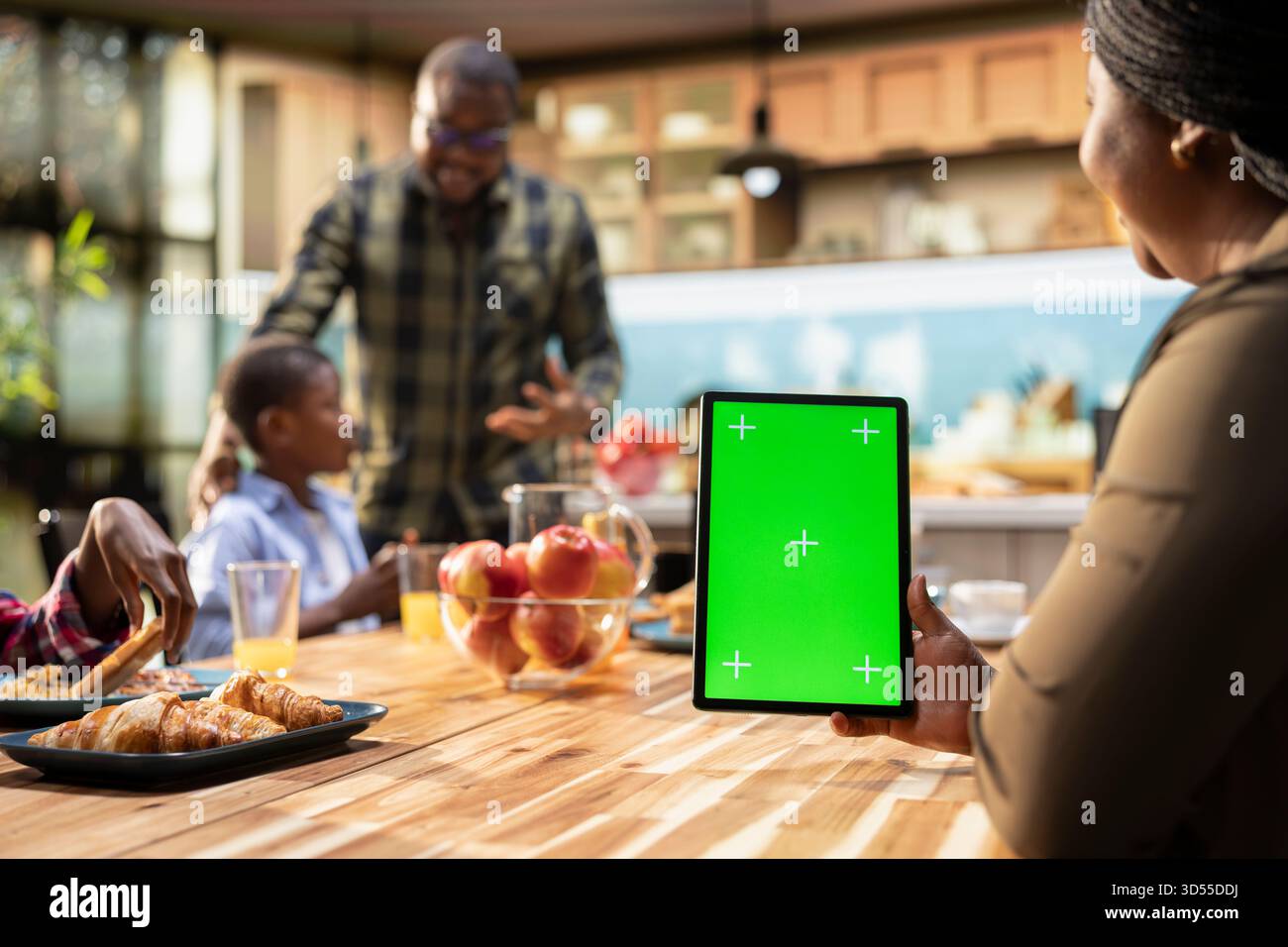 Vertical green screen next to black family enjoying relaxing weekend ...