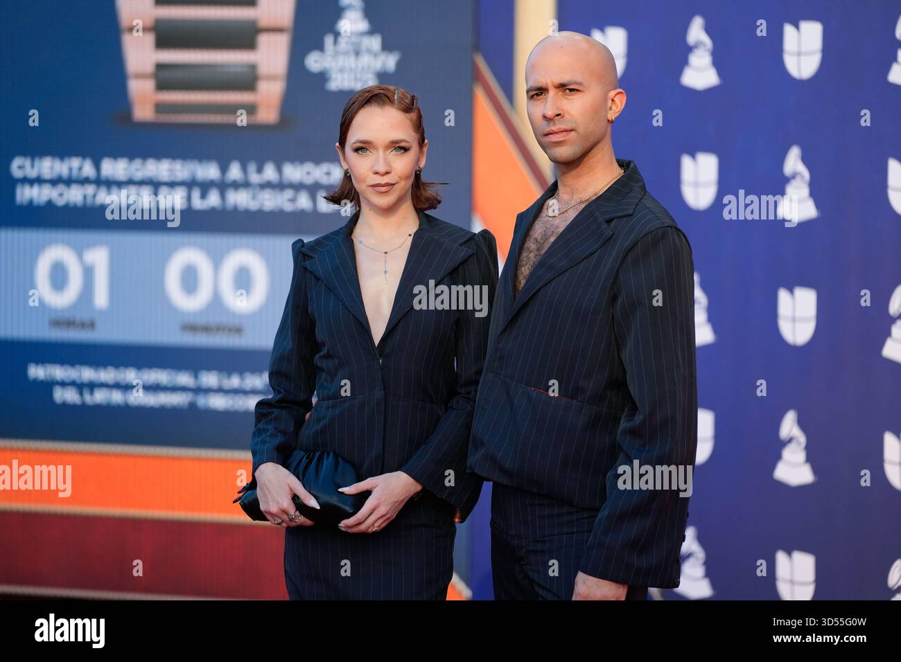 Armando Lopez, right, and Ivanna Zych arrive at the 2025 Latin Grammys ...