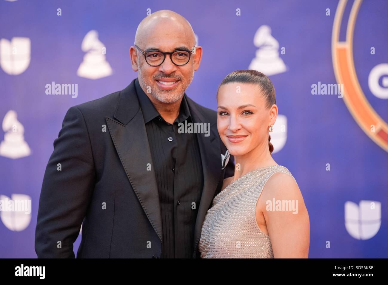 Harvey Mason Jr., left, and Britt Burton arrive at the 2025 Latin ...
