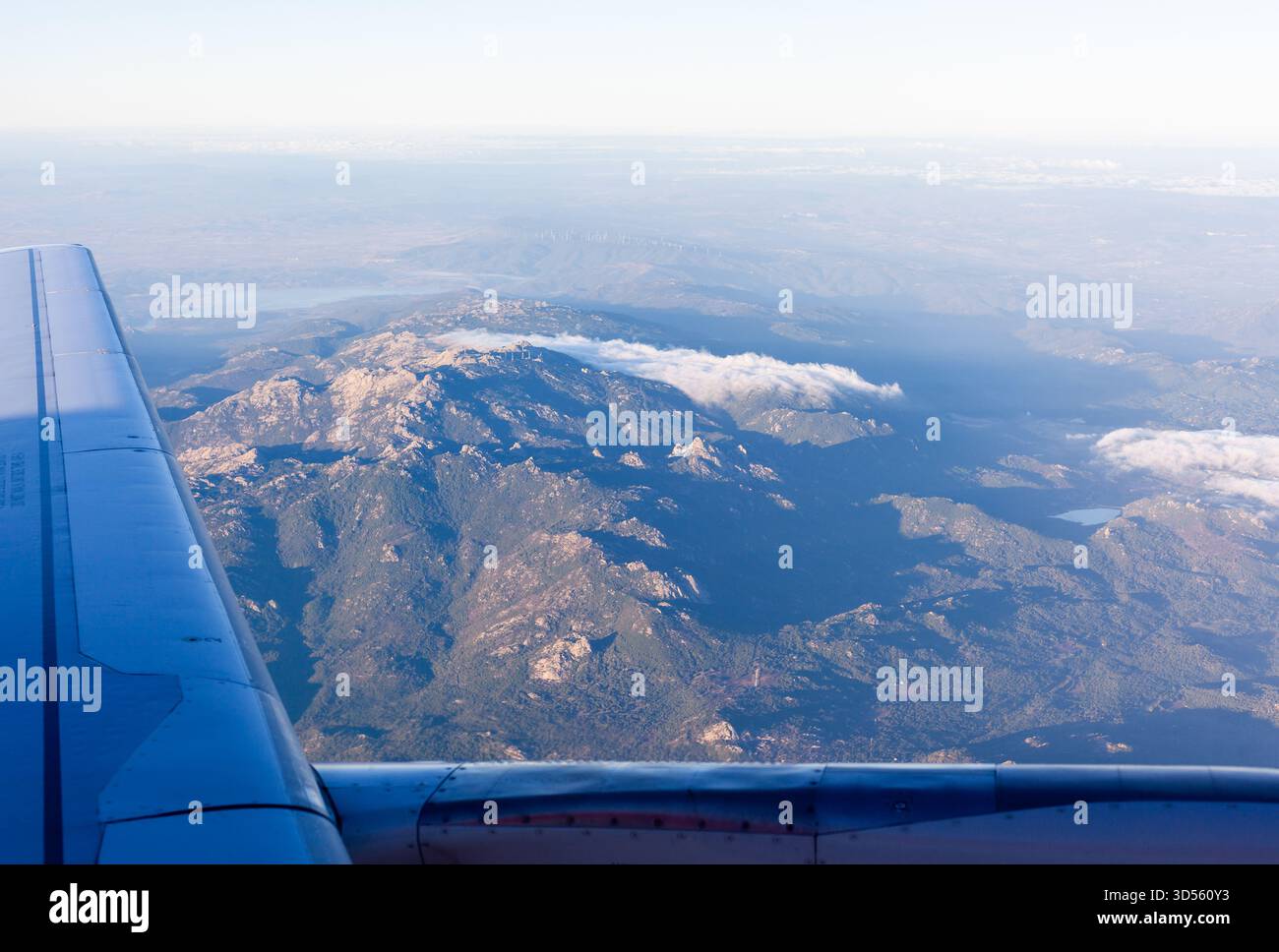 Aerial view of the Alps from an airplane window during a scenic flight ...