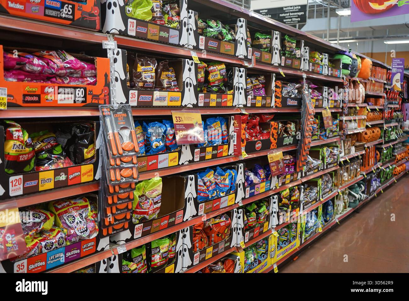 Bags of Halloween candy on the shelves inside the seasonal aisle in a ...