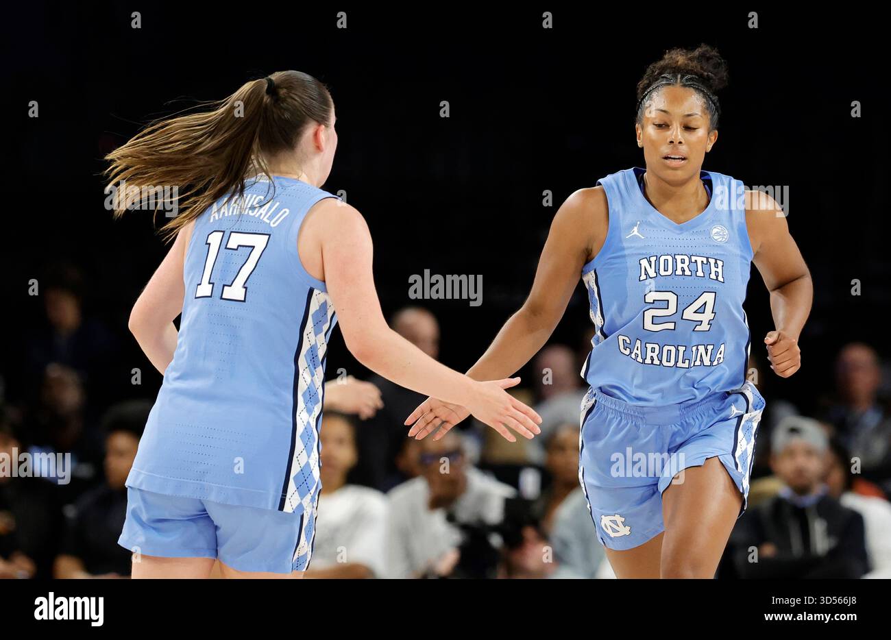 North Carolina guard Indya Nivar (24) is congratulated by guard Elina ...
