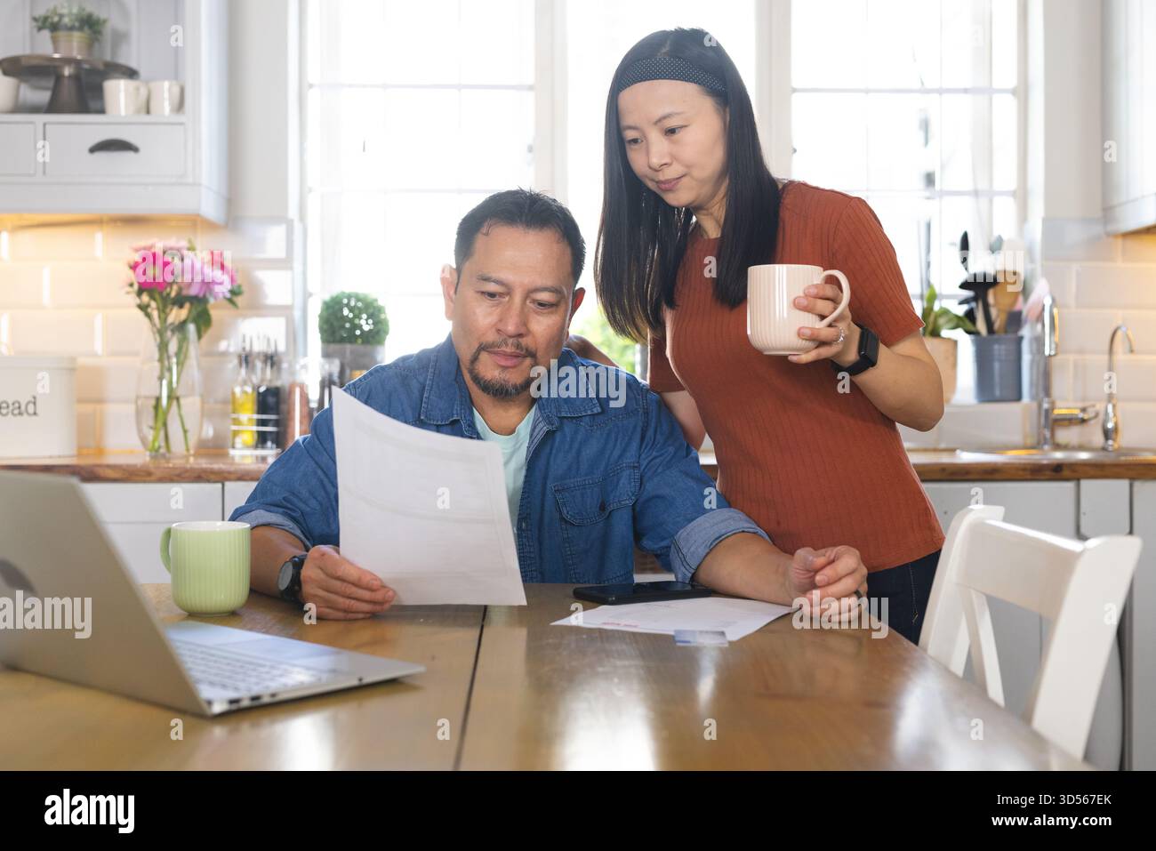 Focused people reviewing documents hi-res stock photography and images ...