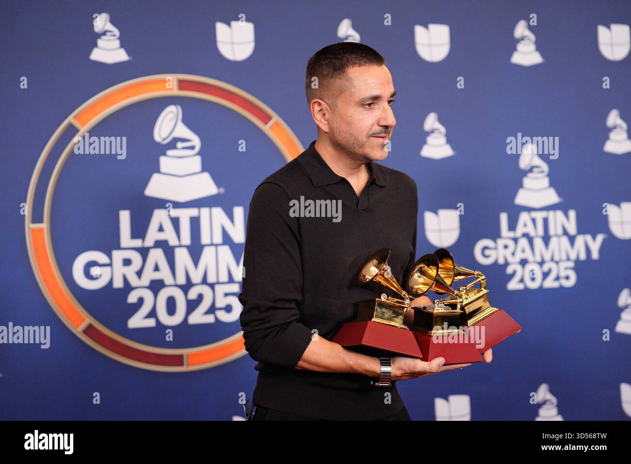Rafa Arcaute poses in the press room with the awards for best pop song ...