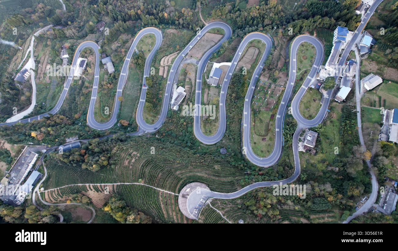 ENSHI, CHINA - NOVEMBER 13, 2025 - A winding mountain road in Enshi ...