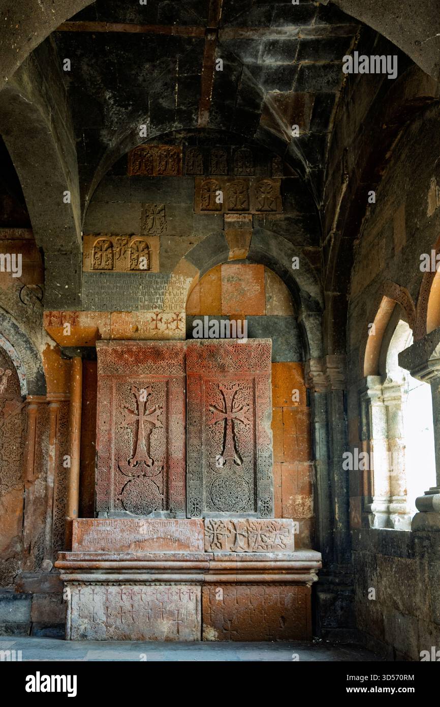 The inside of a Armenian Hovhannavank monastery church with a red and ...