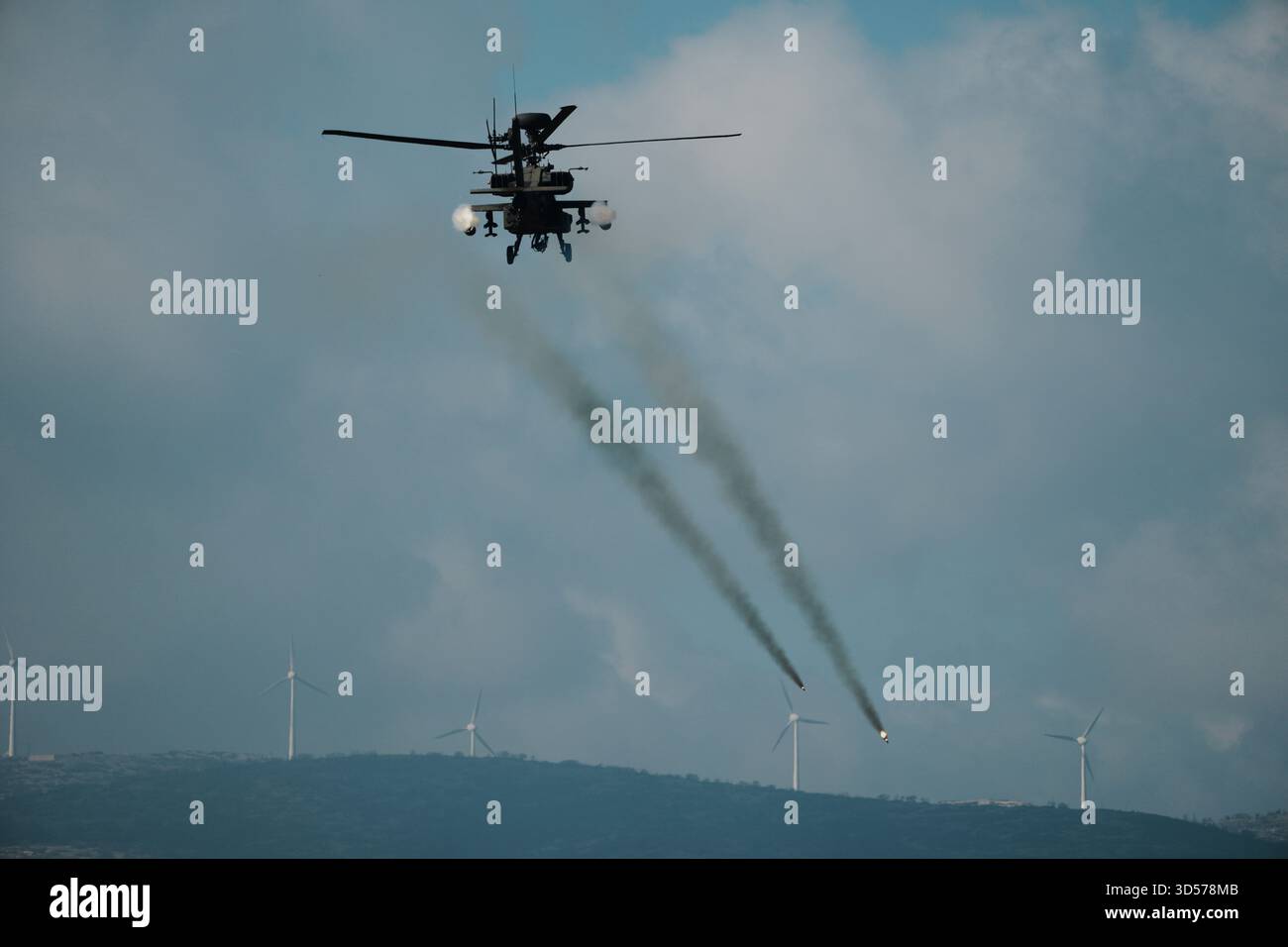 A Greek Military helicopter fires rockets during a live-fire exercise ...