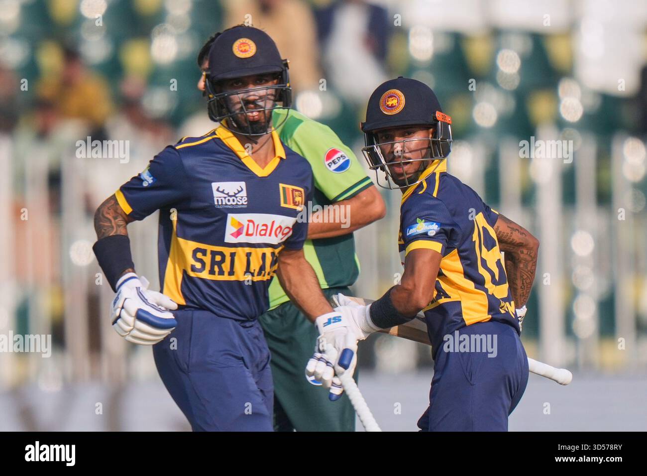 Sri Lanka's Pathum Nissanka, right, Kamil Mishara run between the ...