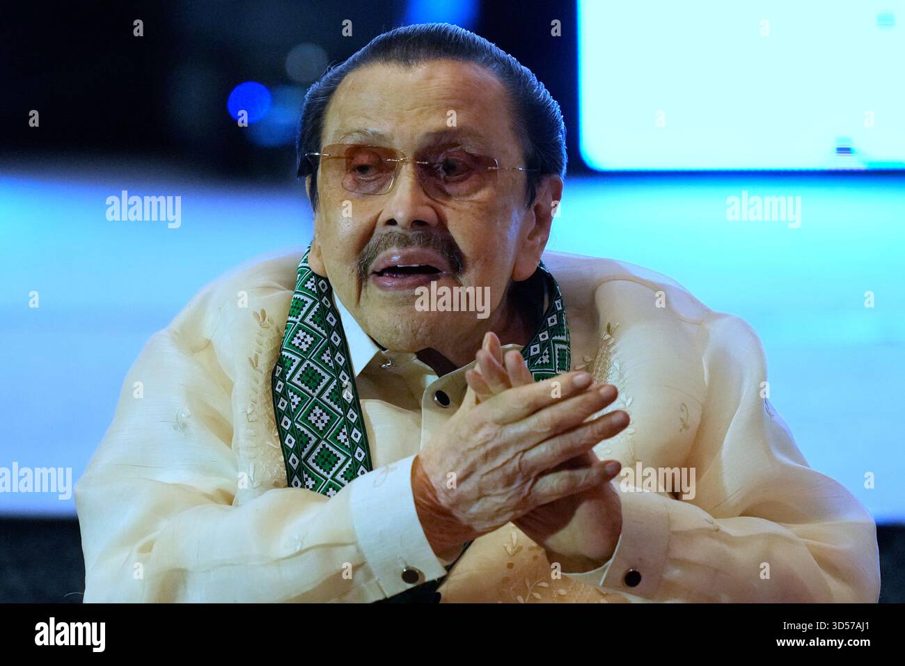 Former Philippine Vice President Joseph Estrada applauds as he attends ...