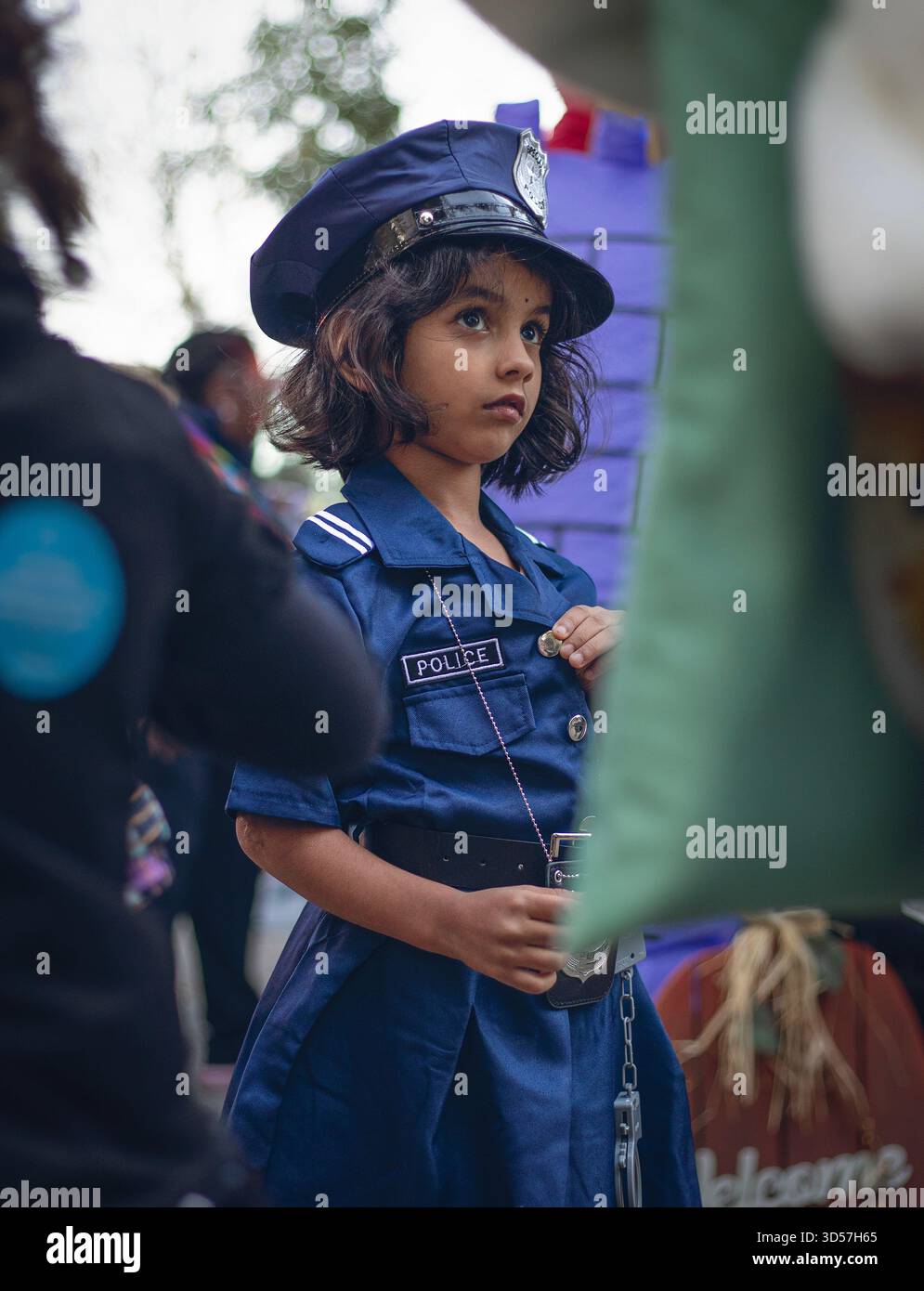 A girl dressed as a police officer for Halloween in Philadelphia Stock ...