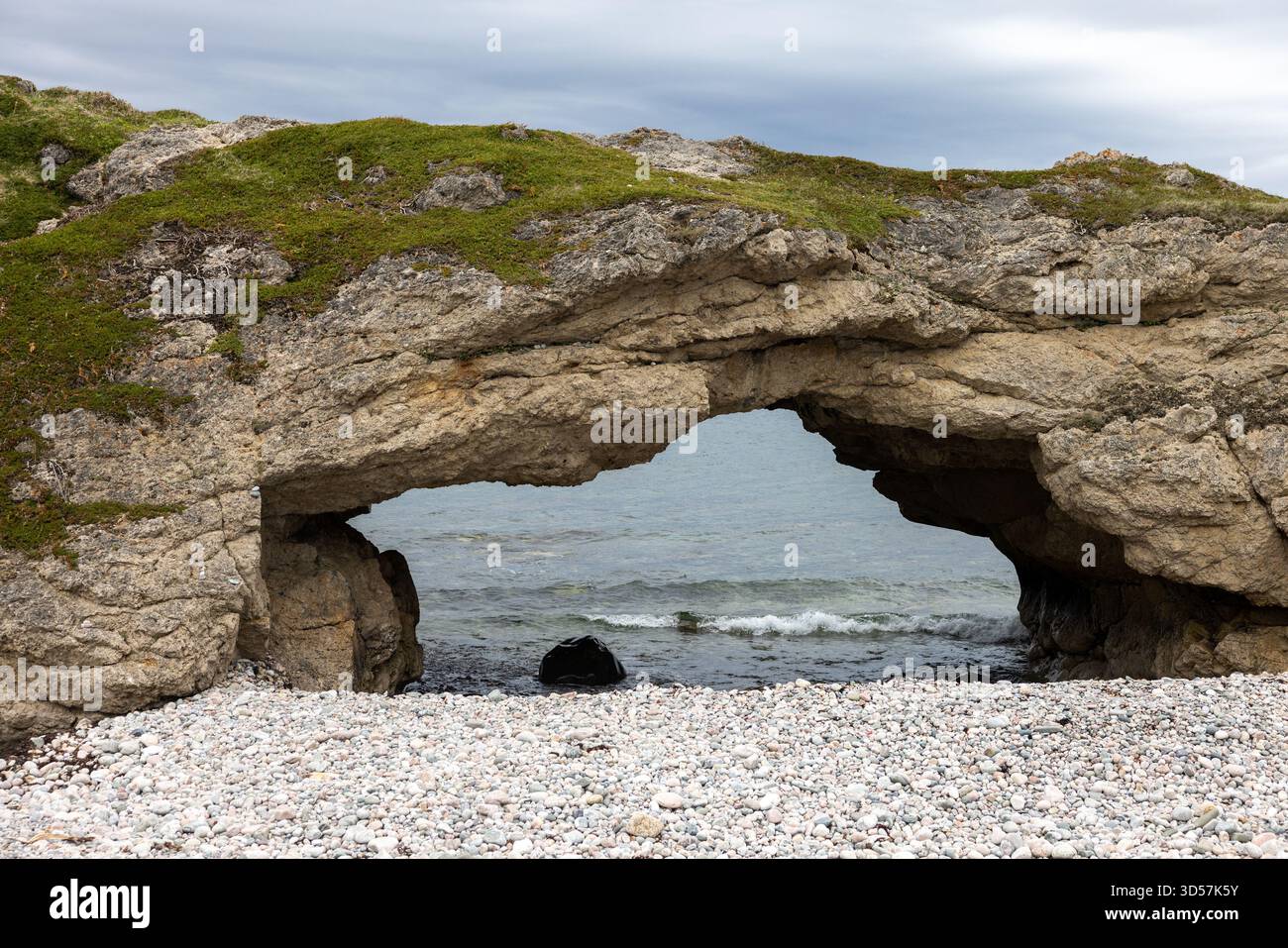 Natural Sea Arch Over a Pebble Beach Stock Photo - Alamy