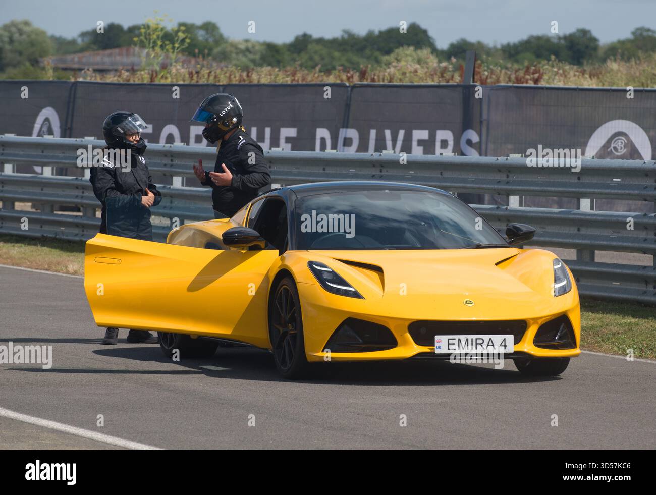 A female driver under instruction in a Lotus Emira, at the ...