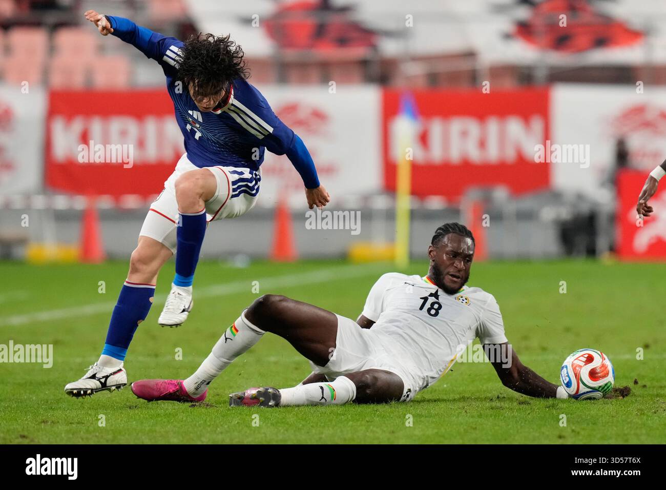 Ghana's Jerome Opoku, bottom, battles for the ball against Japan's ...
