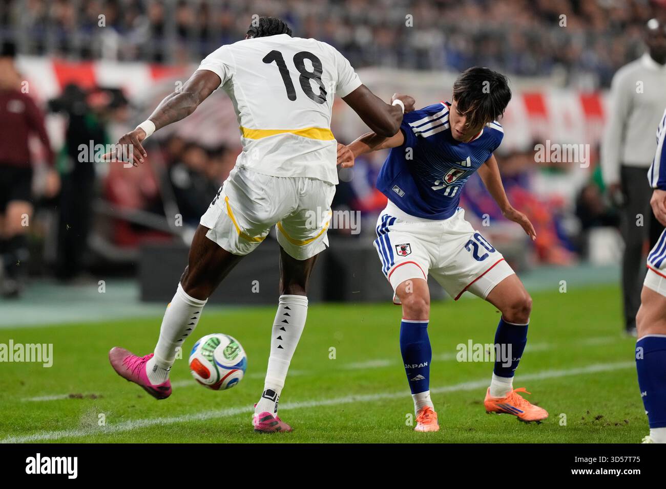 Japan's Takefusa Kubo, right, battles for the ball against Ghana's ...